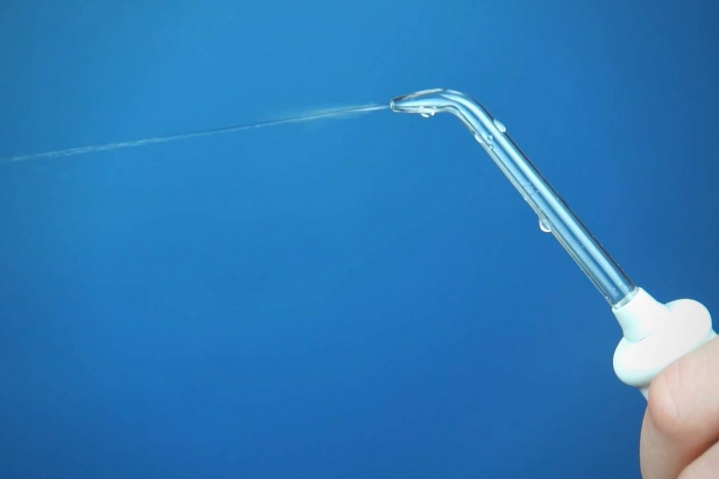 How Does a Water Flosser Work? | Surreal Home